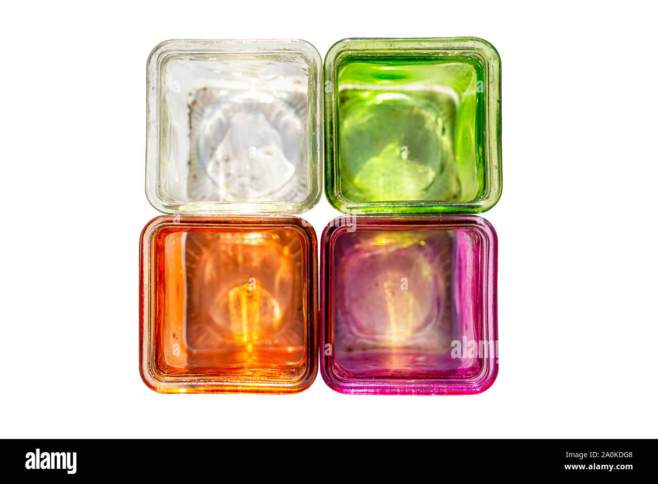Colored glass coasters for tealights, flat lay, isolated on a white ...