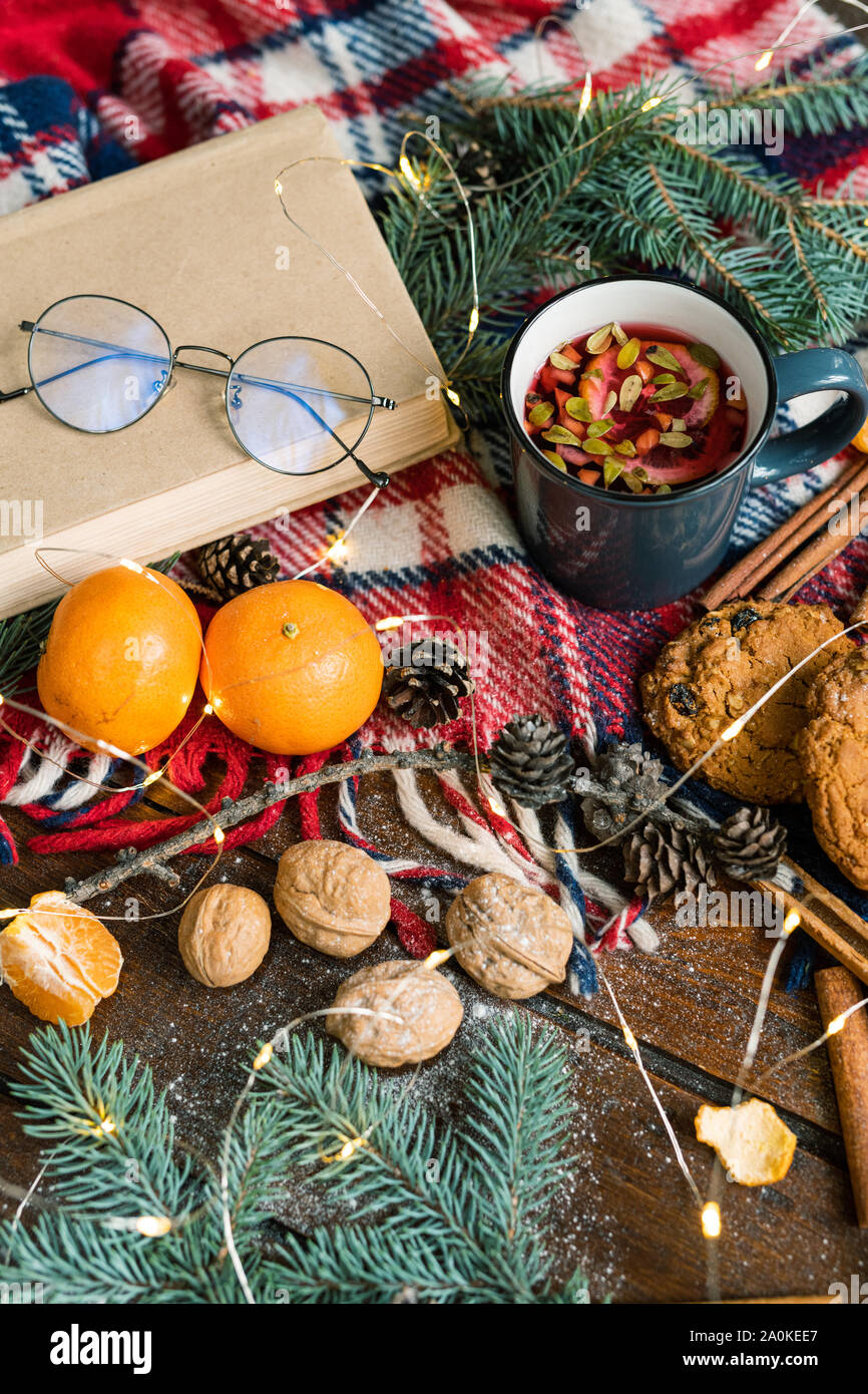 Hot tea with lemon and lingonberry leaves and other food and symbols of ...