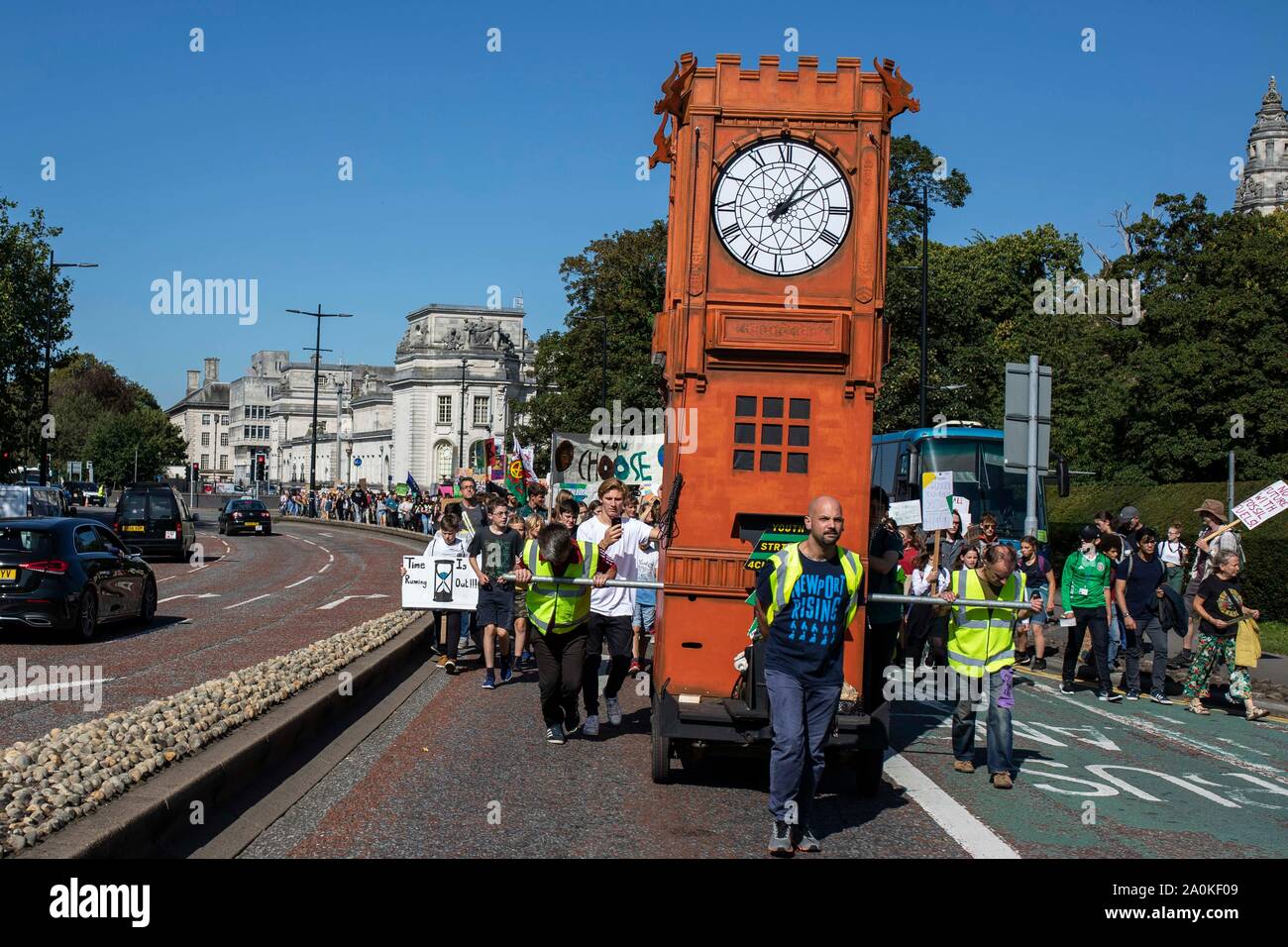 A giant clock is pulled through Cardiff city centre during a protest ...