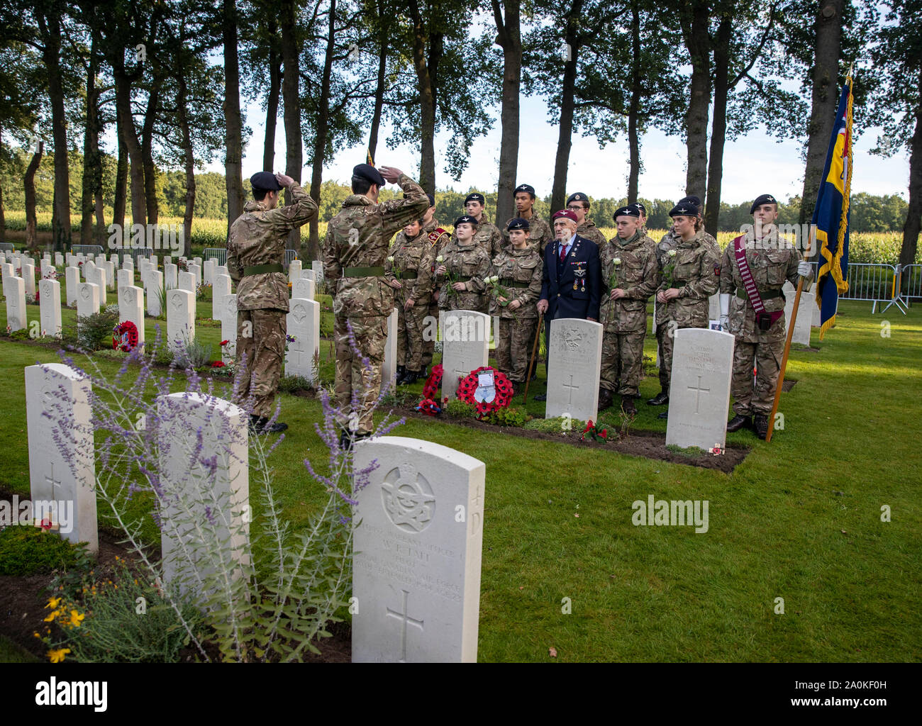 A veteran joins cadets from St Mary's College, Merseyside as they lay a ...
