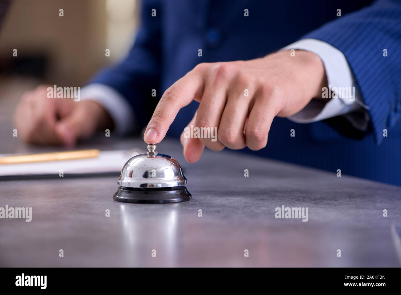The hotel reception bell at the counter Stock Photo - Alamy