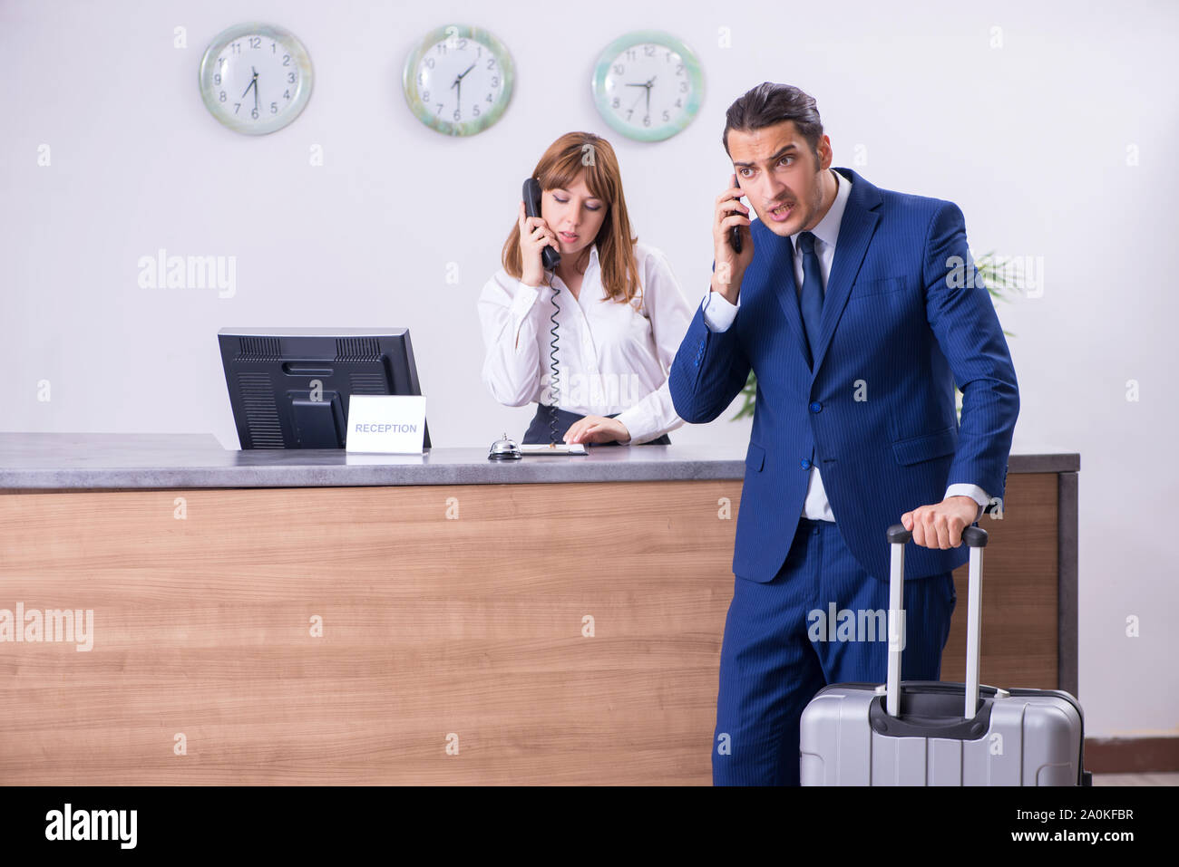 The young businessman at hotel reception Stock Photo - Alamy