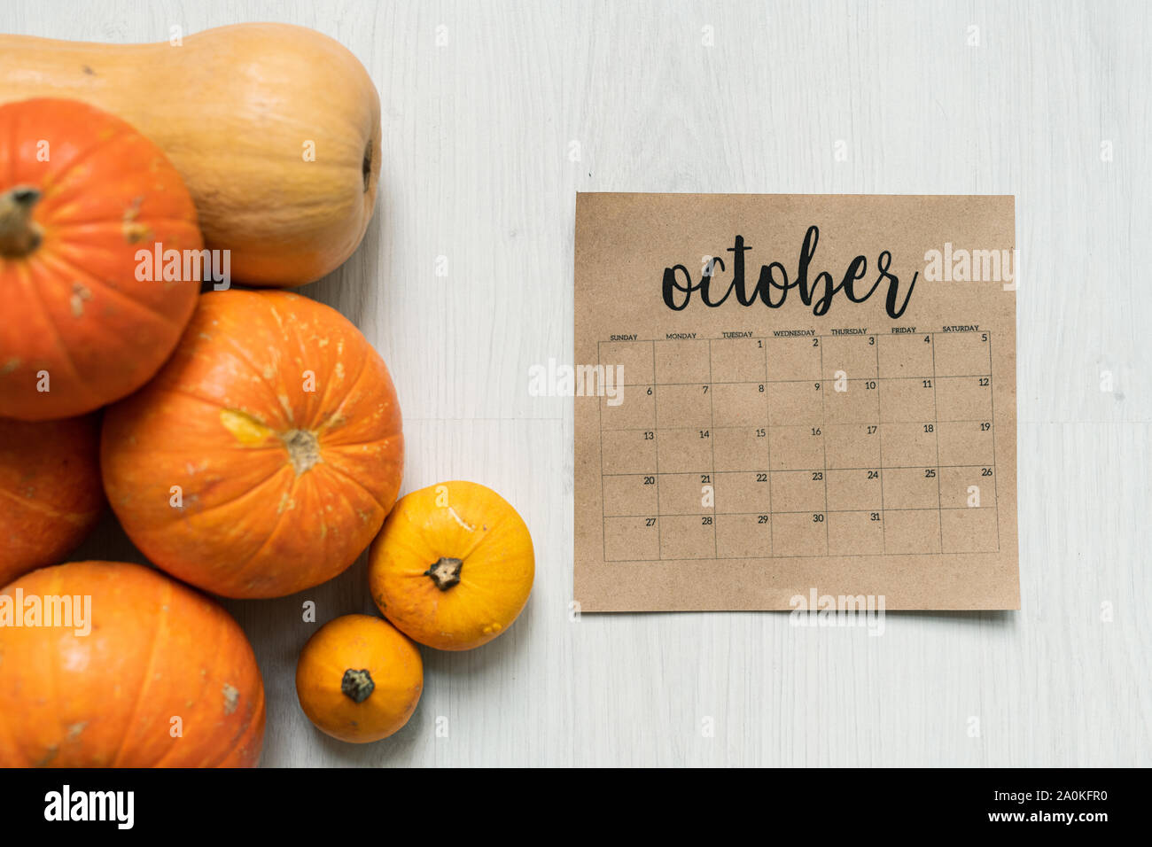 Overview of October calendar sheet and group of ripe orange and yellow ...