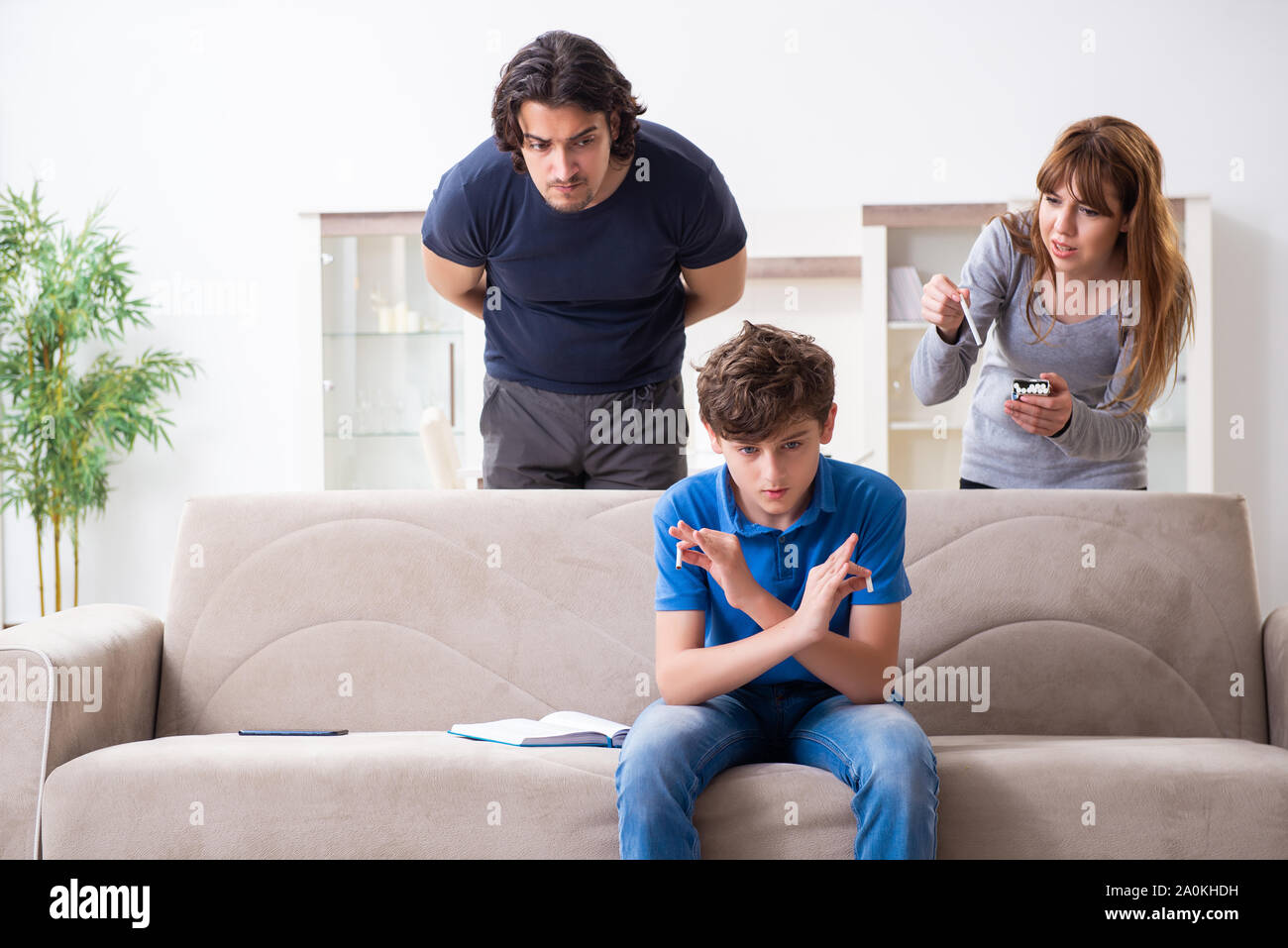 The concept of underage smoking with young boy and family Stock Photo ...