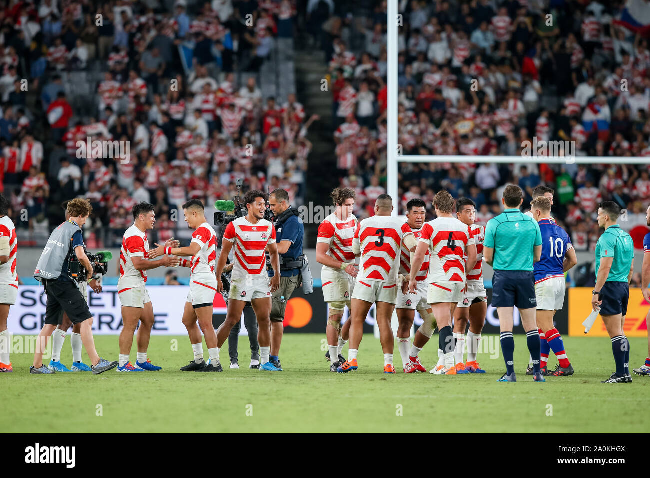 Japan players celebrate after winning the 2019 Rugby World Cup Pool A ...