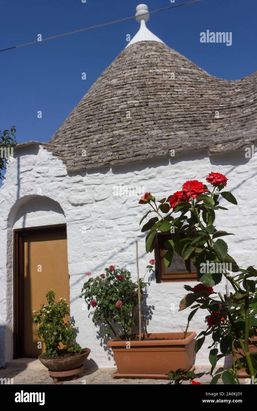 ALBEROBELLO, ITALY - AUGUSt 27 2017: Exterior of a traditional trullo ...