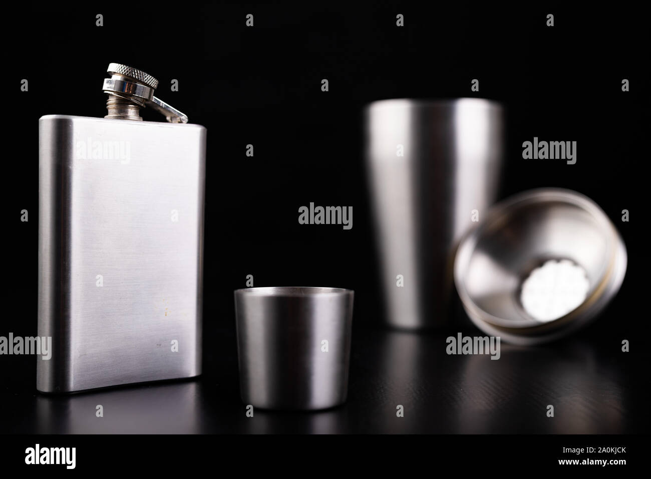 Hip flask and stainless steel shaker. Bartender accessories on the ...