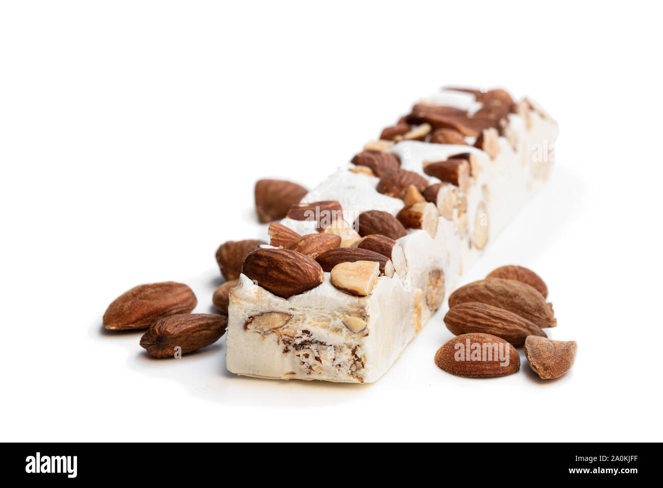 Homemade nougat bar with almonds isolated on white Stock Photo - Alamy
