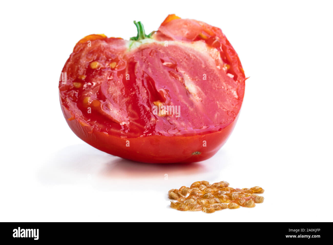 Process of manual tomato seeds extraction isolated on white Stock Photo ...