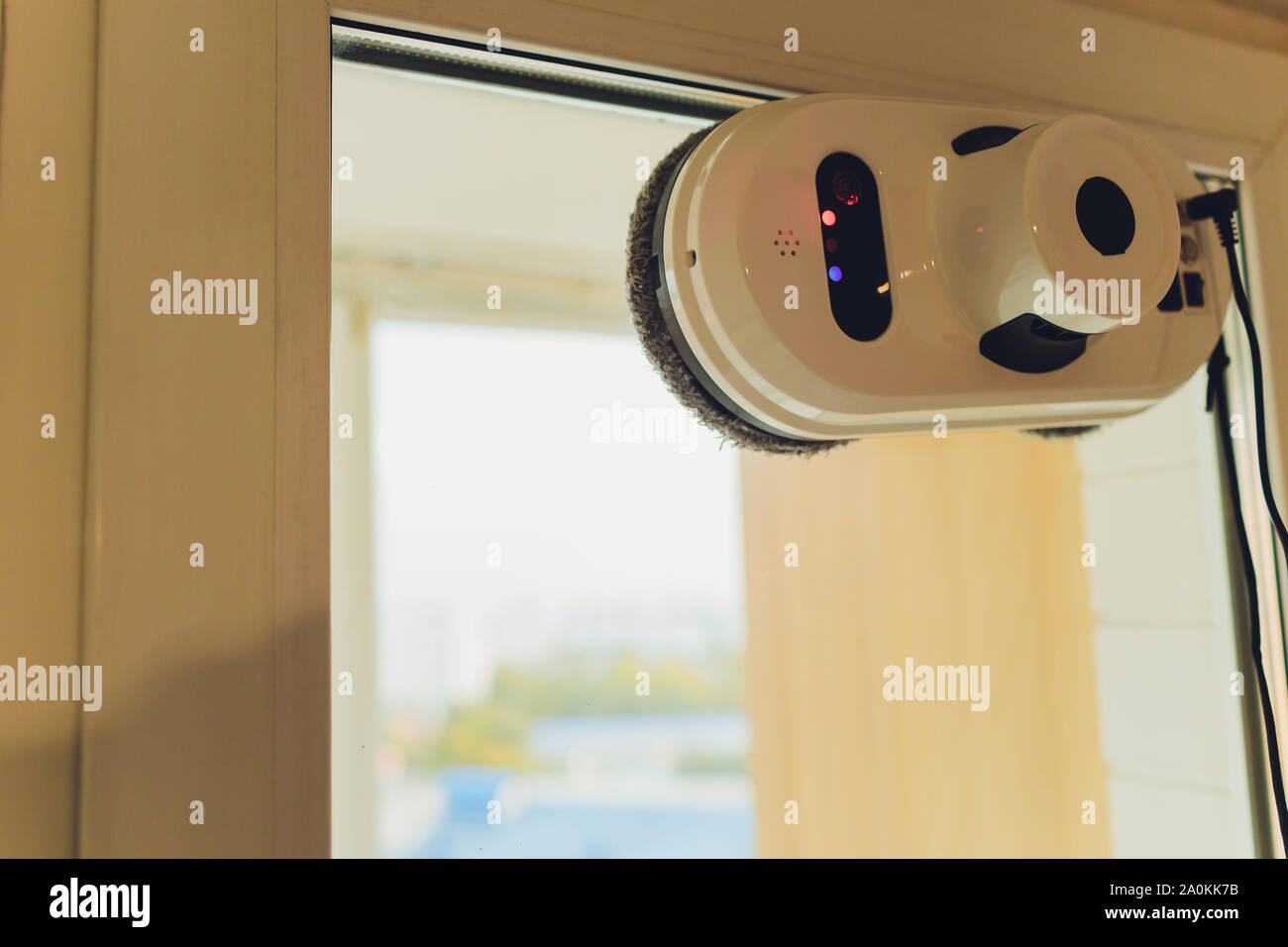 Vacuum cleaner robot cleaning window in high building outdoor Stock ...