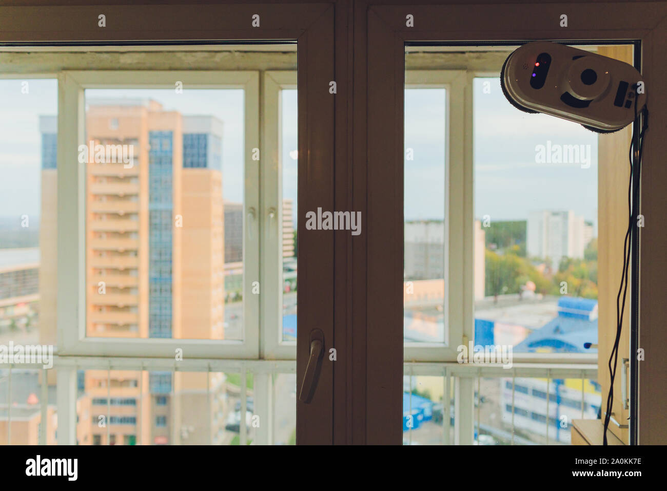Vacuum cleaner robot cleaning window in high building outdoor Stock ...