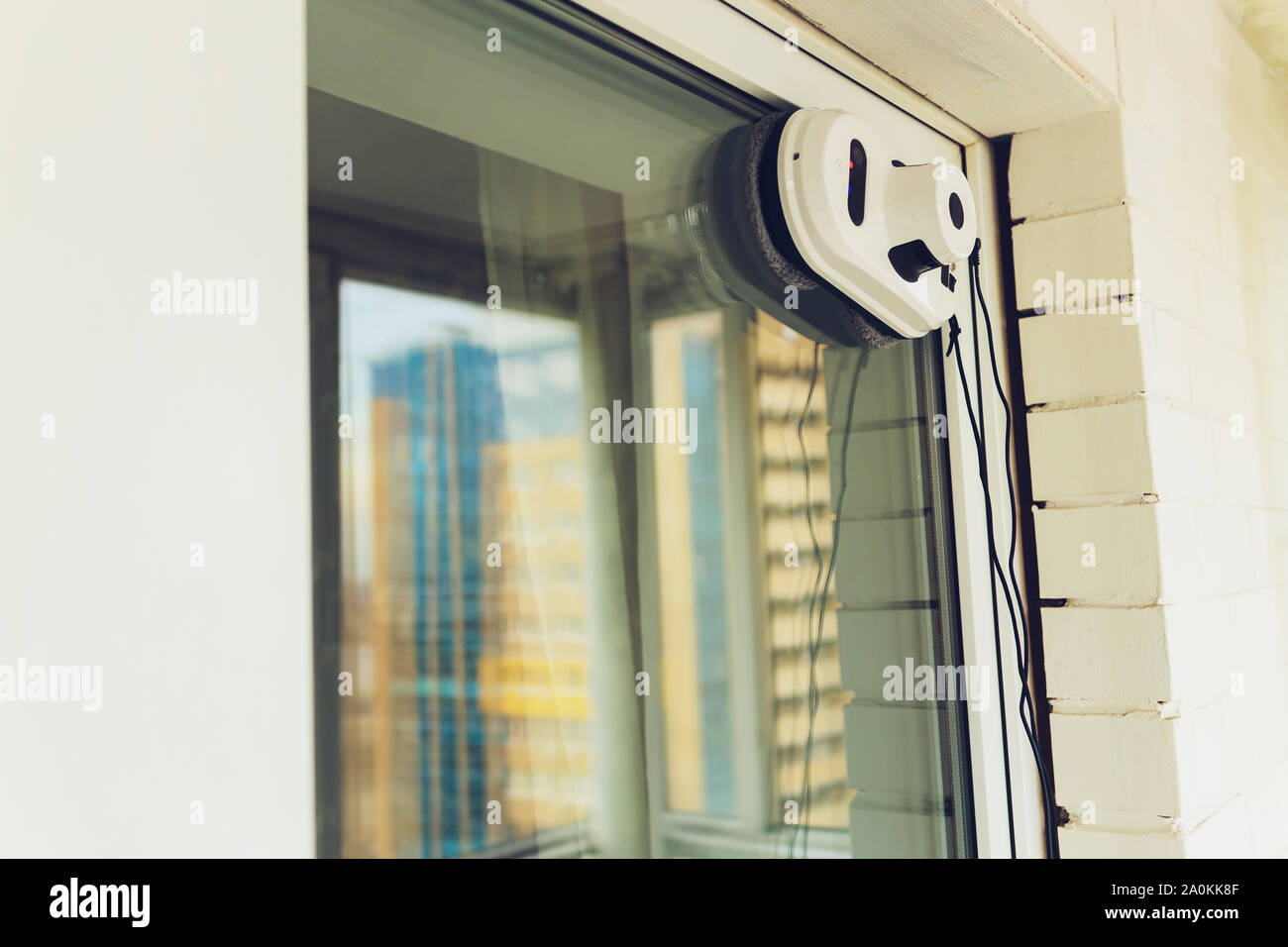 Vacuum cleaner robot cleaning window in high building outdoor Stock ...