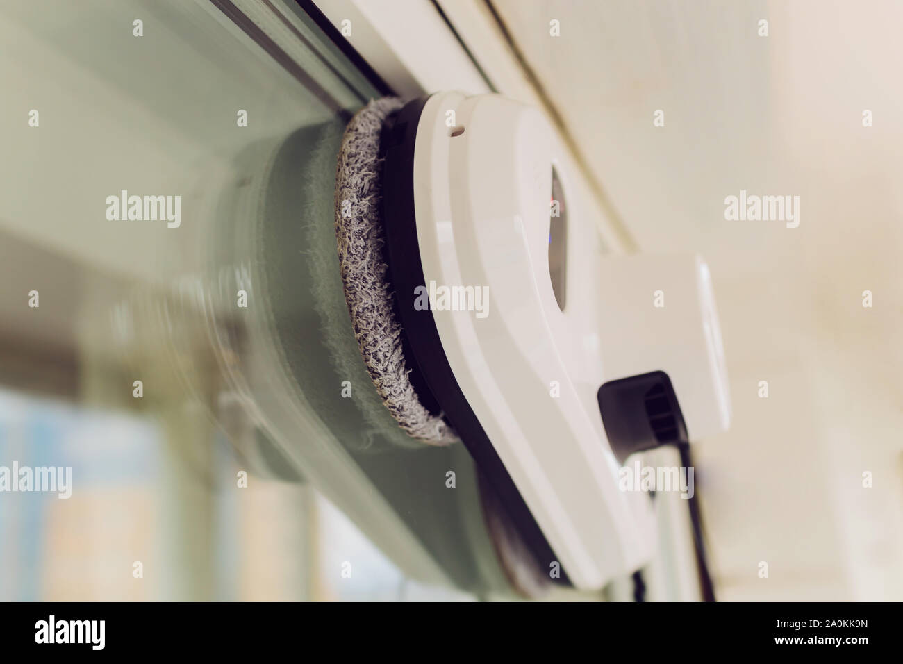 Vacuum cleaner robot cleaning window in high building outdoor Stock ...