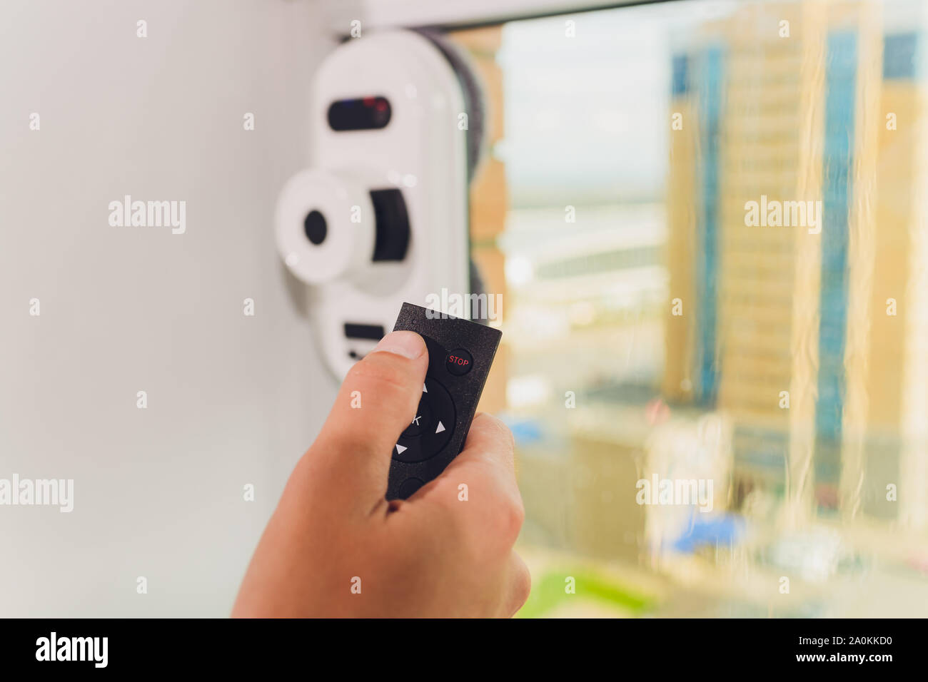 Vacuum cleaner robot cleaning window in high building outdoor Stock ...