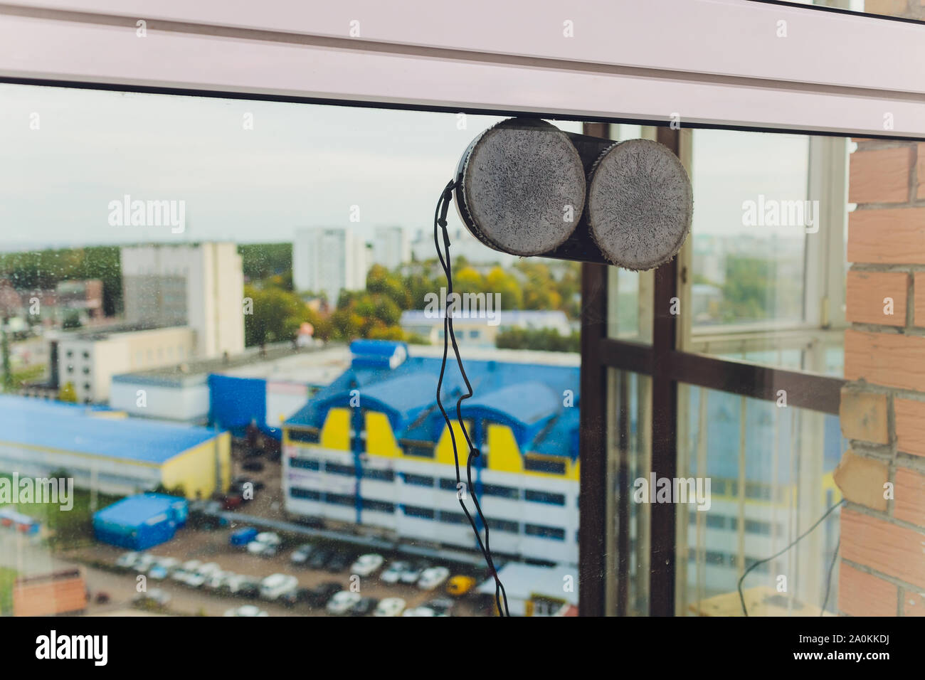 Vacuum cleaner robot cleaning window in high building outdoor Stock ...