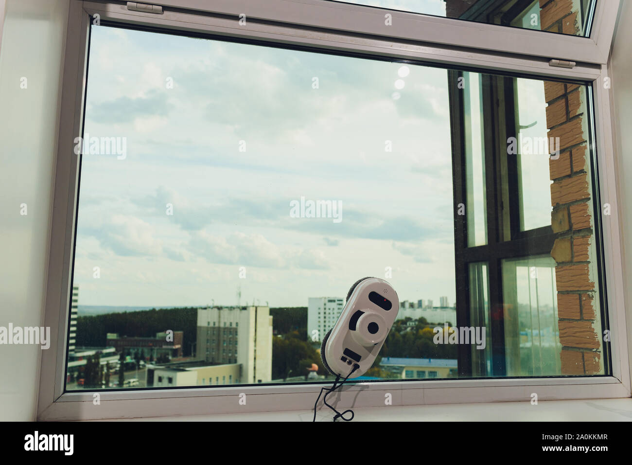 Vacuum cleaner robot cleaning window in high building outdoor Stock ...