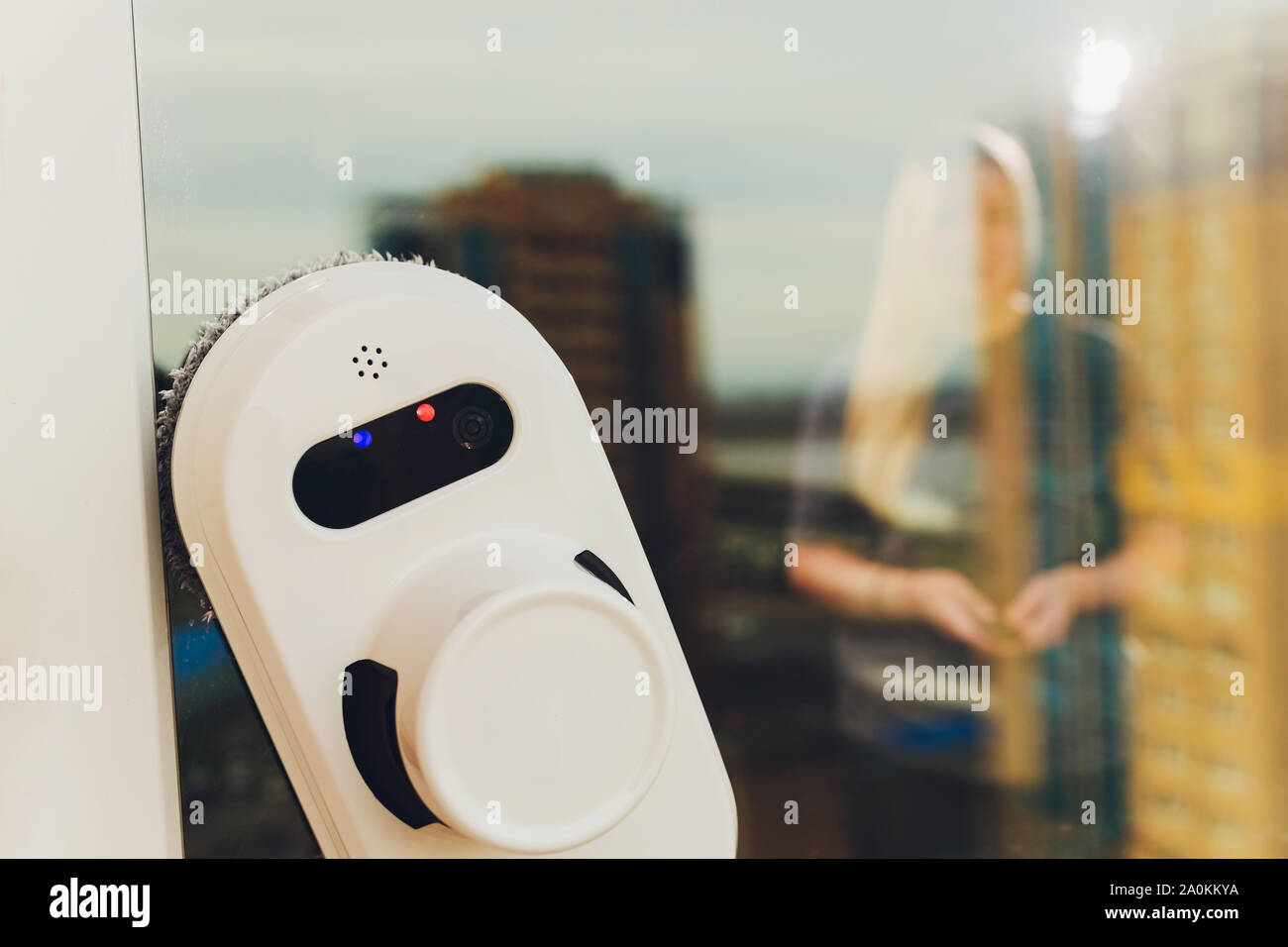 Vacuum cleaner robot cleaning window in high building outdoor Stock ...