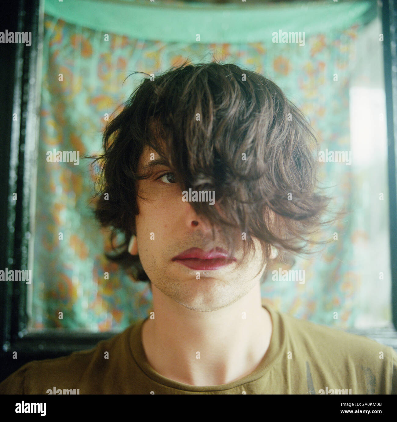 Man with Hair Over his Eyes, Red Lipstick Stock Photo - Alamy