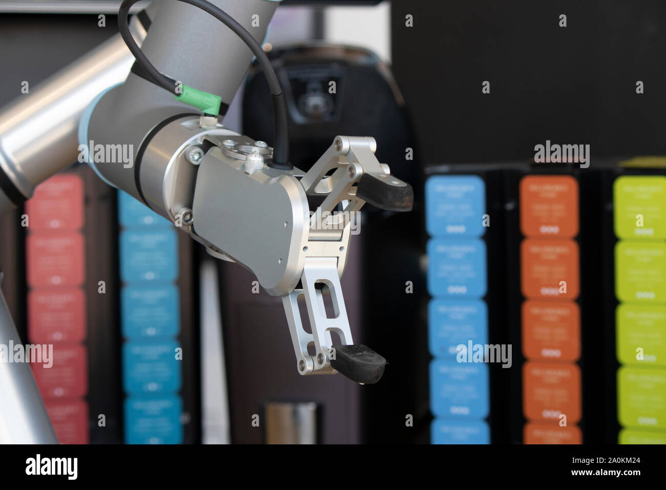 Robotic arm close-up. Background in various colors Stock Photo - Alamy