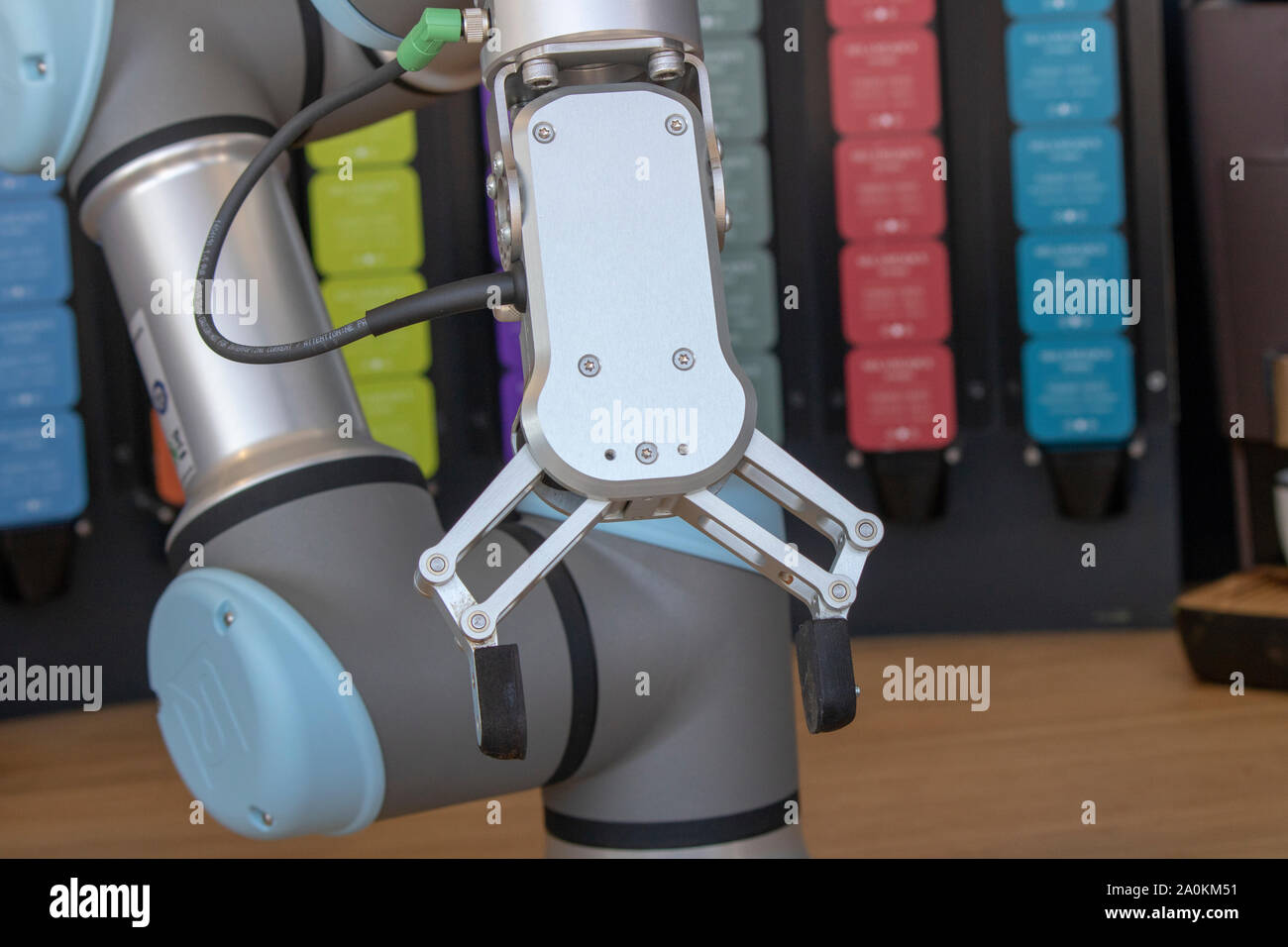 Robotic arm close-up. Background in various colors Stock Photo - Alamy