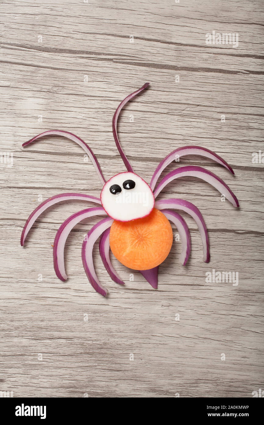 Creative idea for making a spider with vegetables Stock Photo - Alamy
