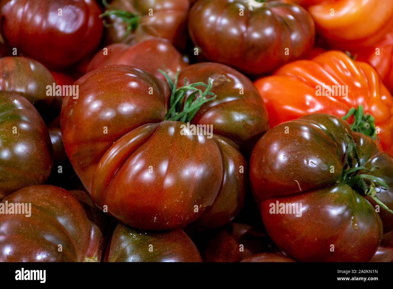 Big ripe french tomatoes, food background close up Stock Photo - Alamy