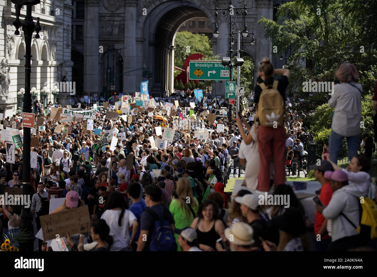 New York, United States. 20th Sep, 2019. Thousands gather and hold up ...
