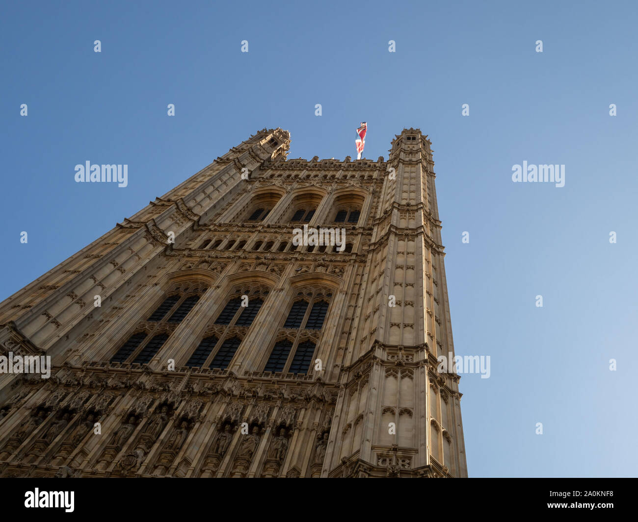 LONDON, UK - SEPTEMBER 20 2019: Union Jack flag flying over the looming ...