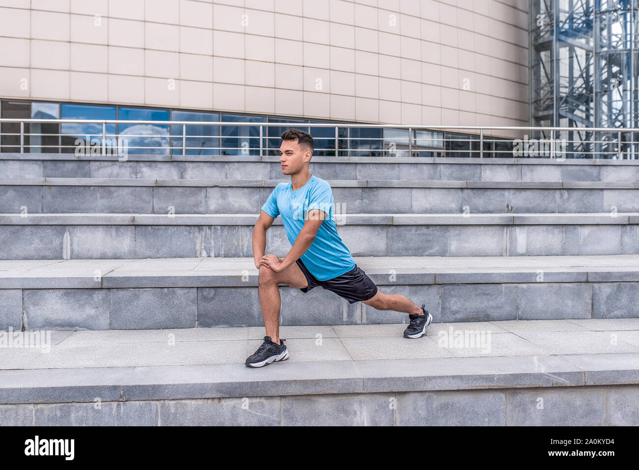 Strong man stretch side lunges hi-res stock photography and images - Alamy