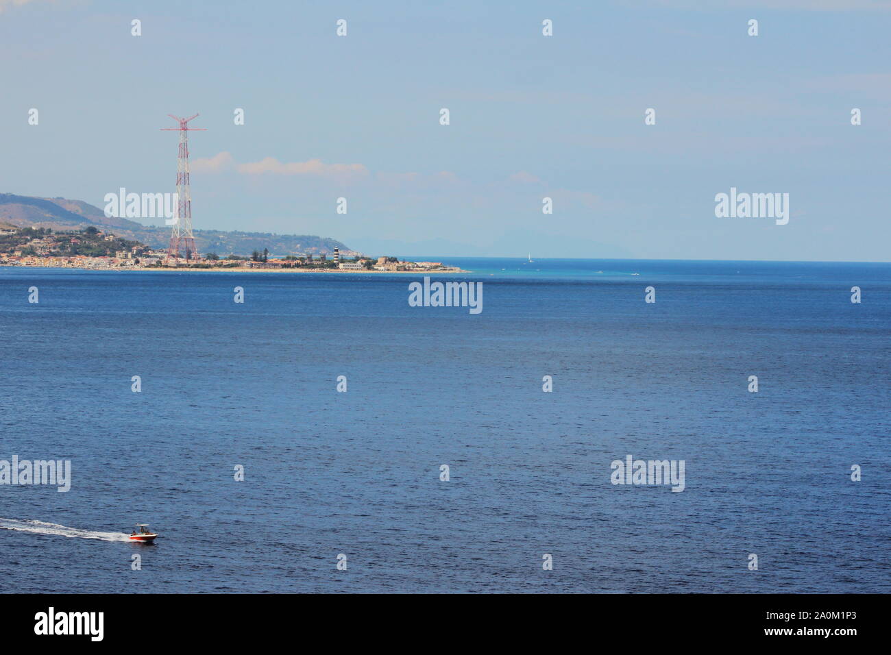 Torre Faro beach with metal voltage tower (pylon),italy Stock Photo - Alamy