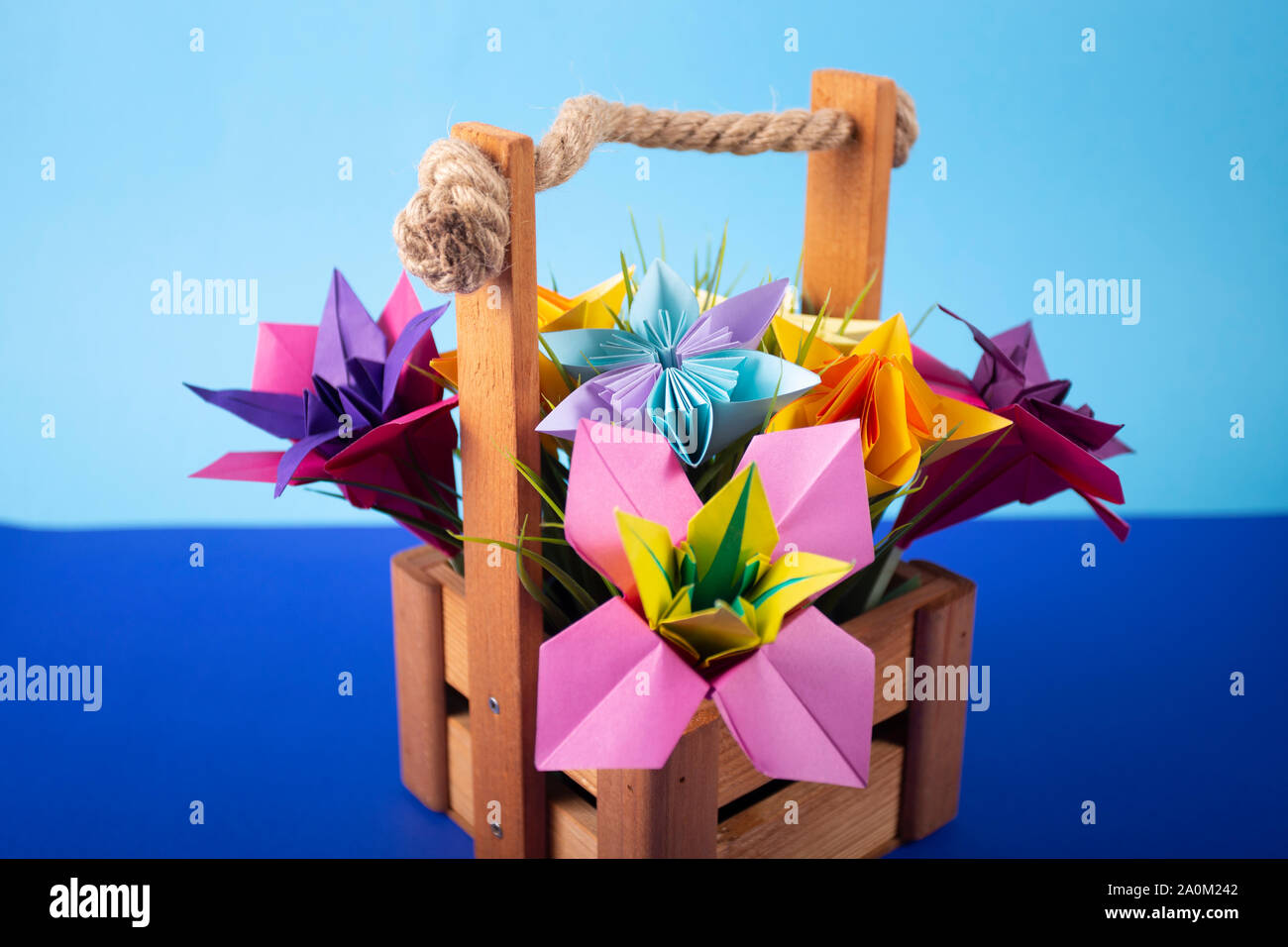Handmade colored paper flowers origami bouquet paper craft art in a ...