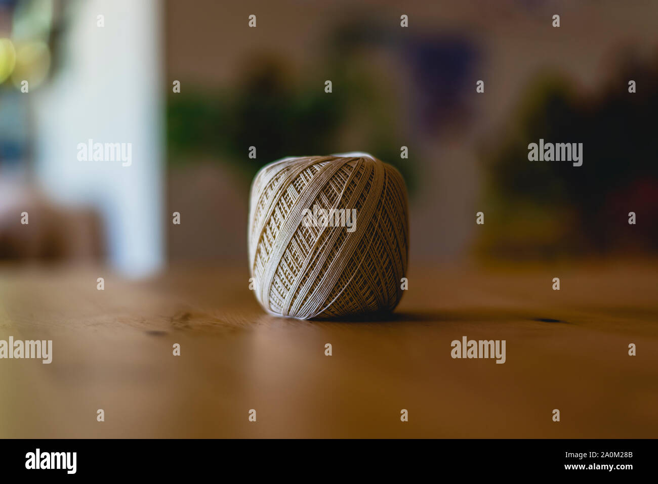 Roll of cotton yarn on a table Stock Photo - Alamy