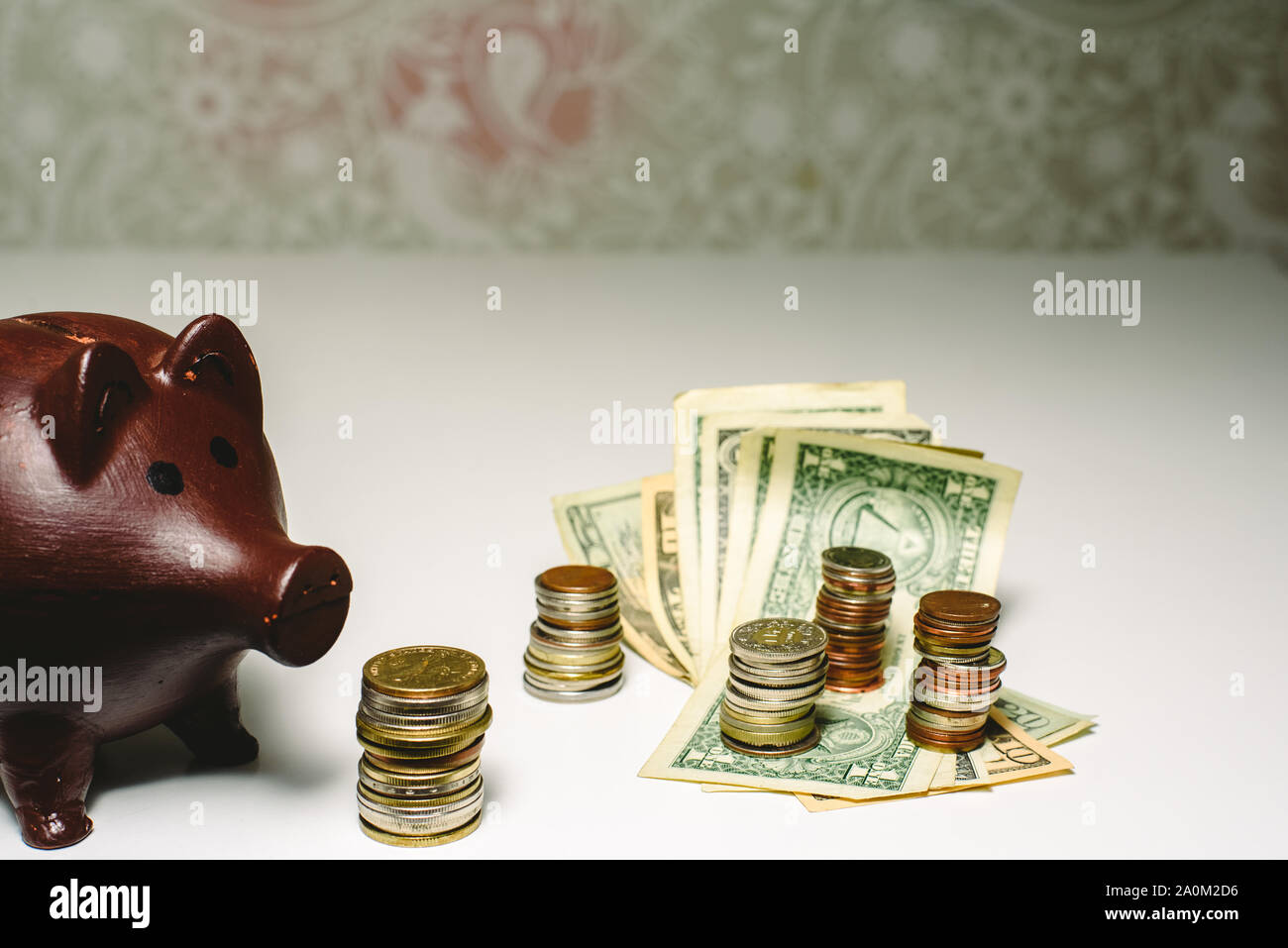 piggy bank, Coins and dollar bills isolated on white background with ...