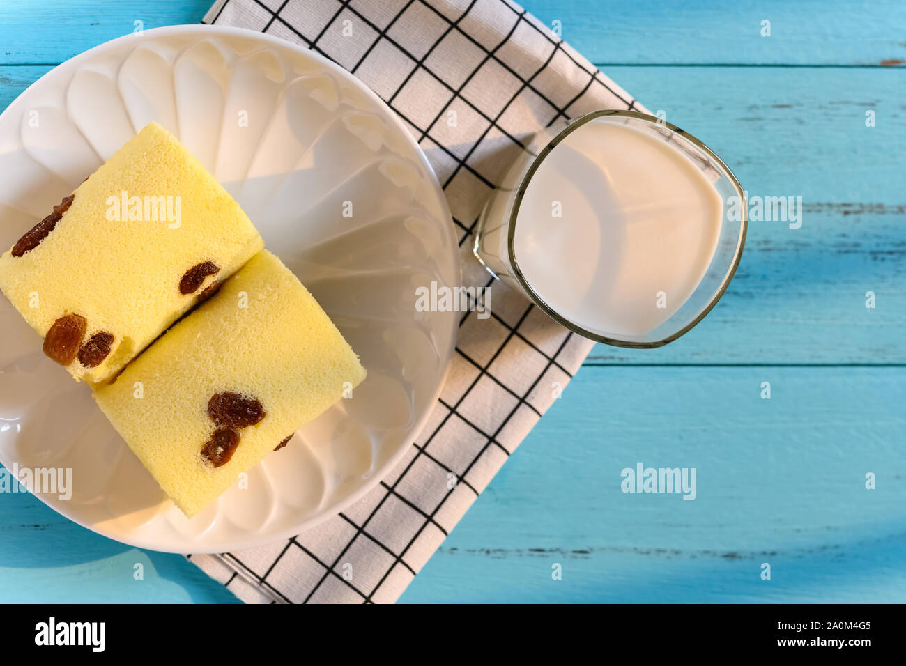 top view cakes with raisin and cup of milk in a sunny morning Stock ...