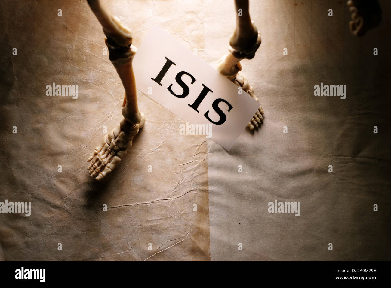 Close up of skeleton holding ISIS label Stock Photo - Alamy