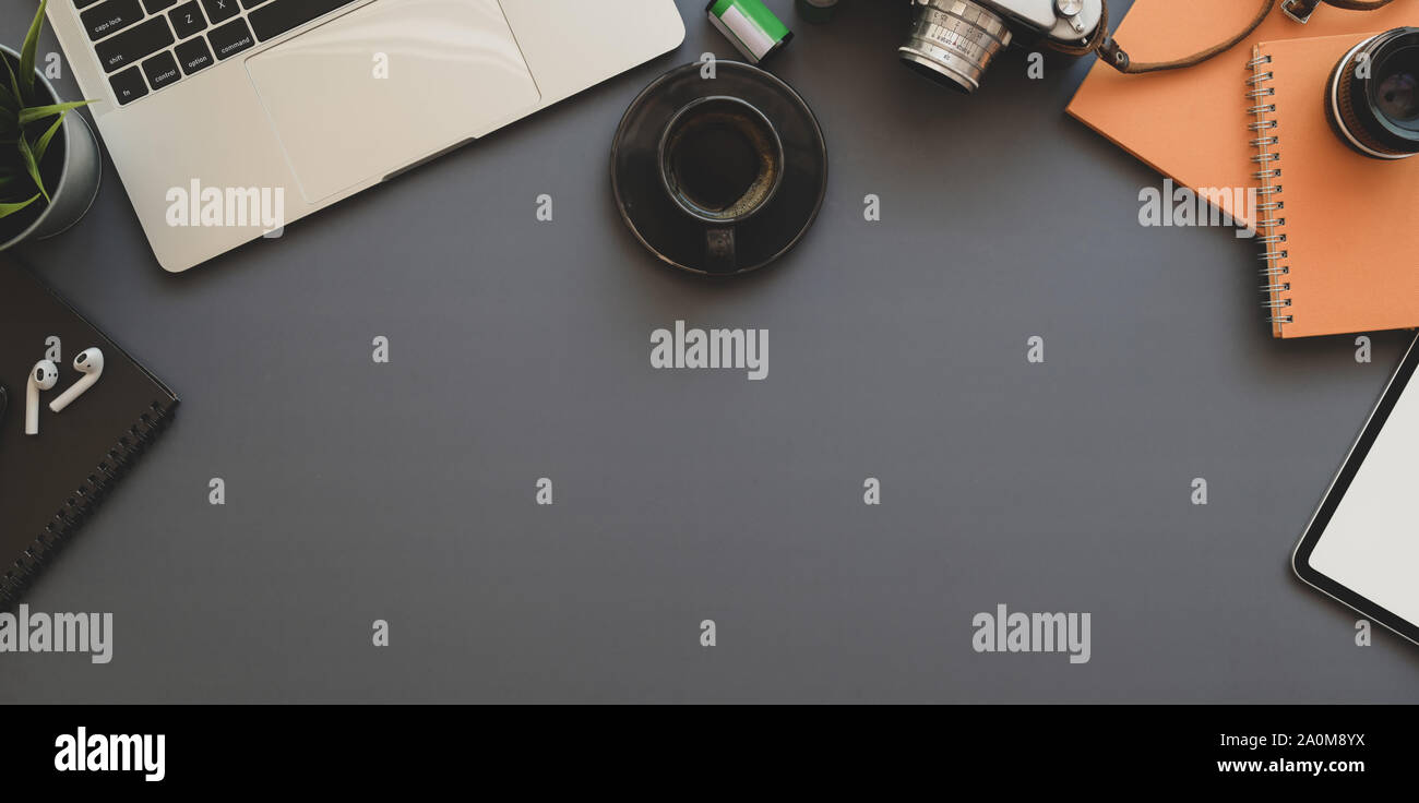 Modern photographer work station with copy space and office supplies on ...