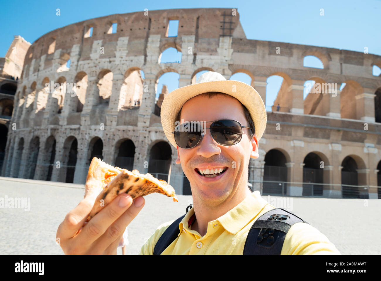 Man Eating Italian Pizza Near Colosseum, Rome Stock Photo - Alamy