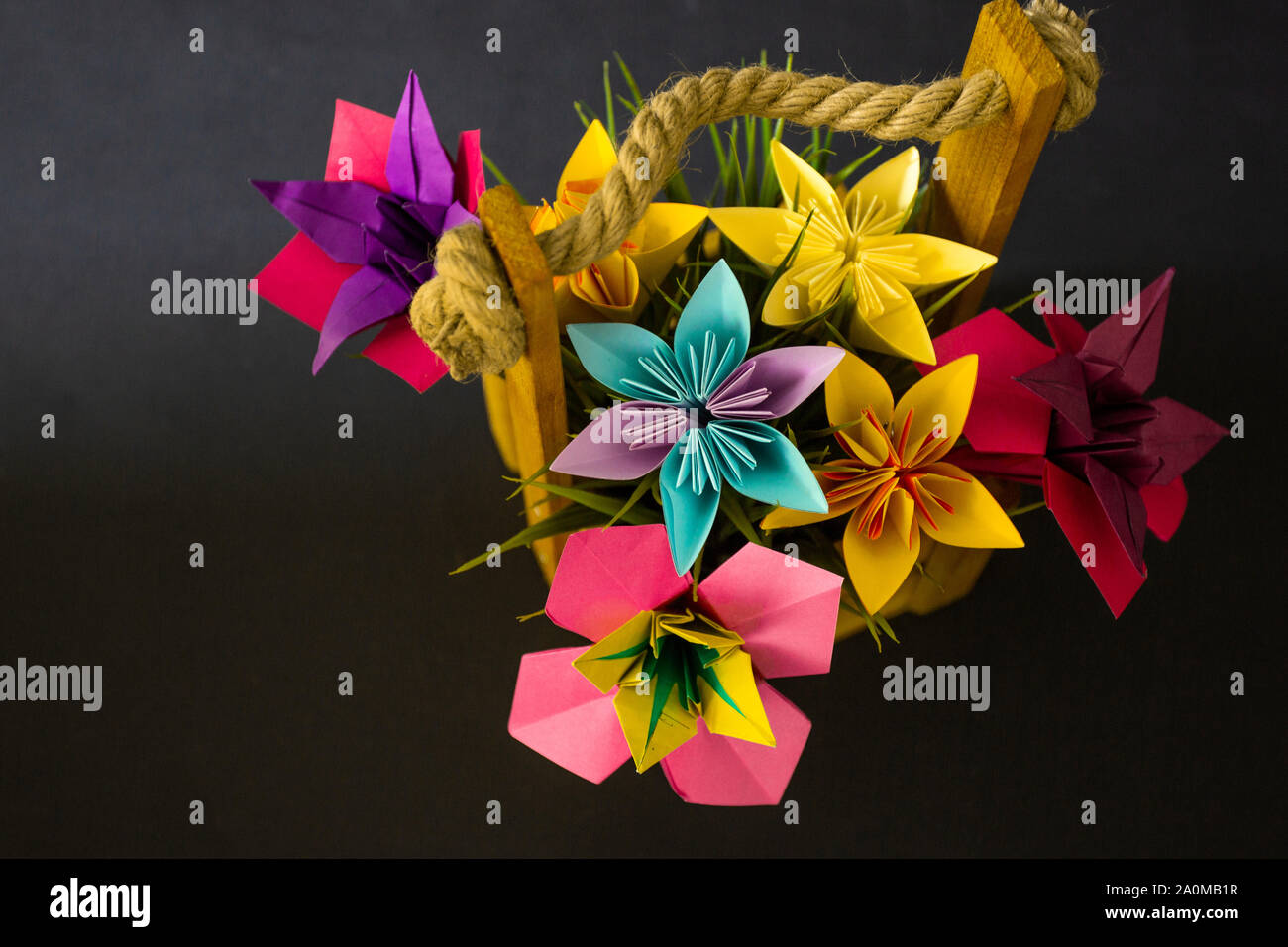 Handmade colored paper flowers origami bouquet paper craft art in a ...