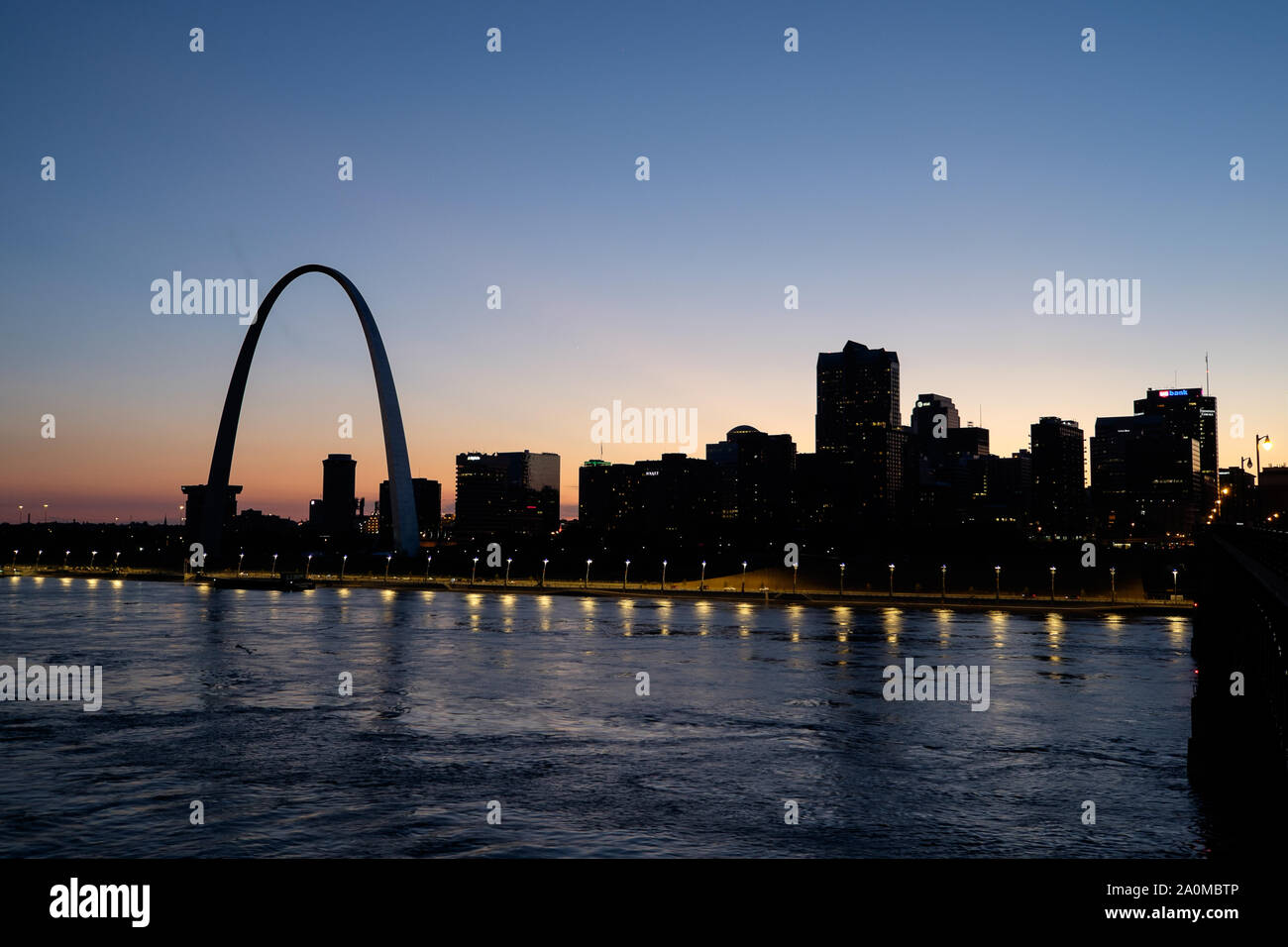 With the Gateway Arch standing out against a colorful sunset, the St ...