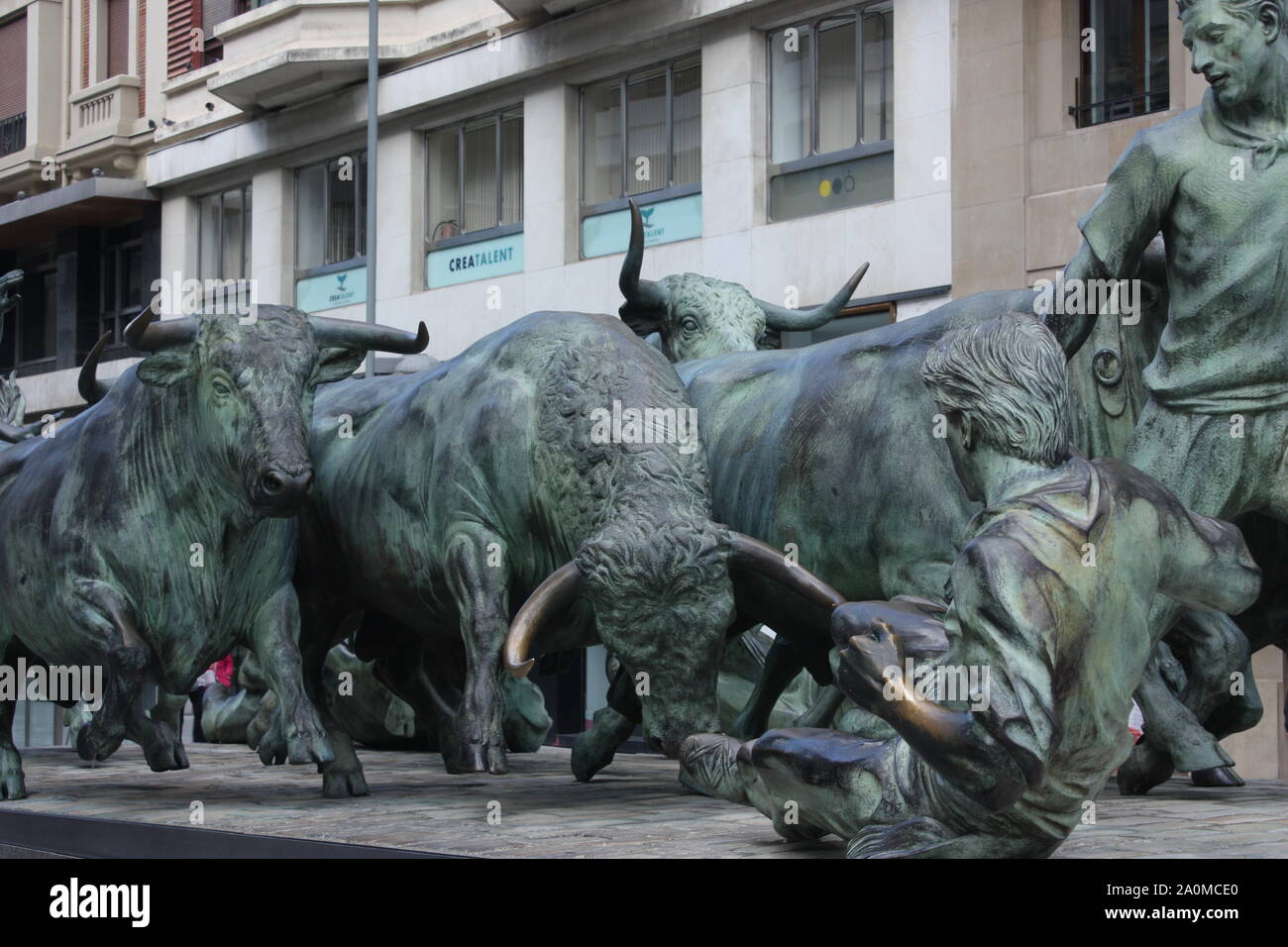 A statue commemorating The Running of The Bulls or Encierro in Pamplona ...
