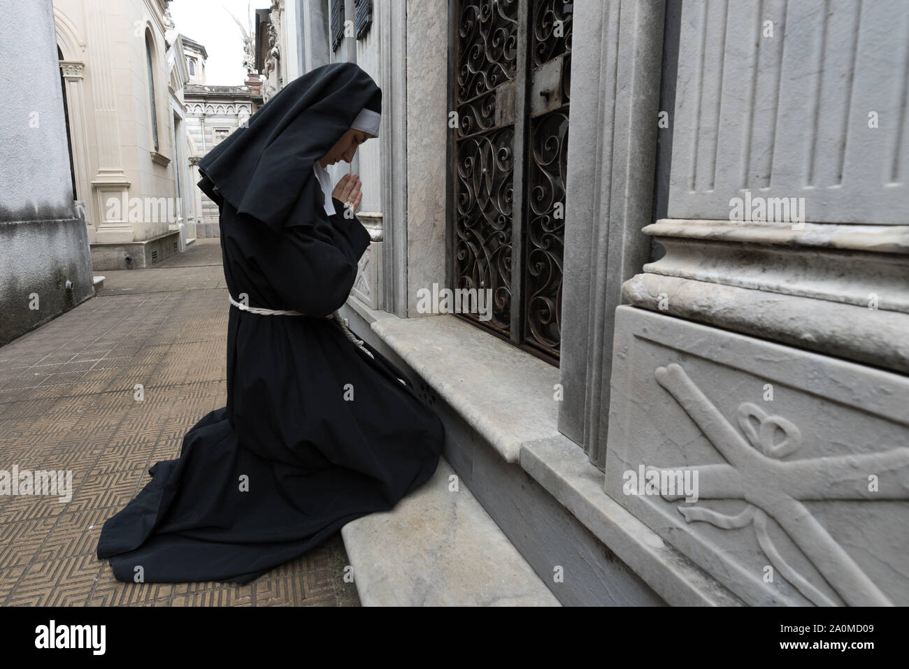 Buenos Aires, Argentina - May 27 2017: Nun praying for he dead inside ...