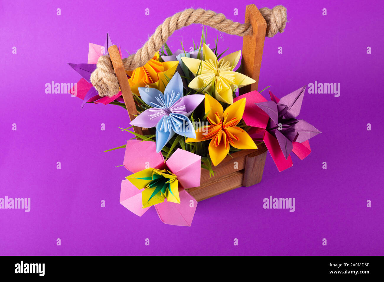 Handmade colored paper flowers origami bouquet paper craft art in a ...