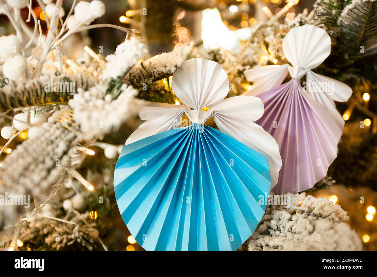 New Year handmade angel papercraft origami figures on christmas tree ...