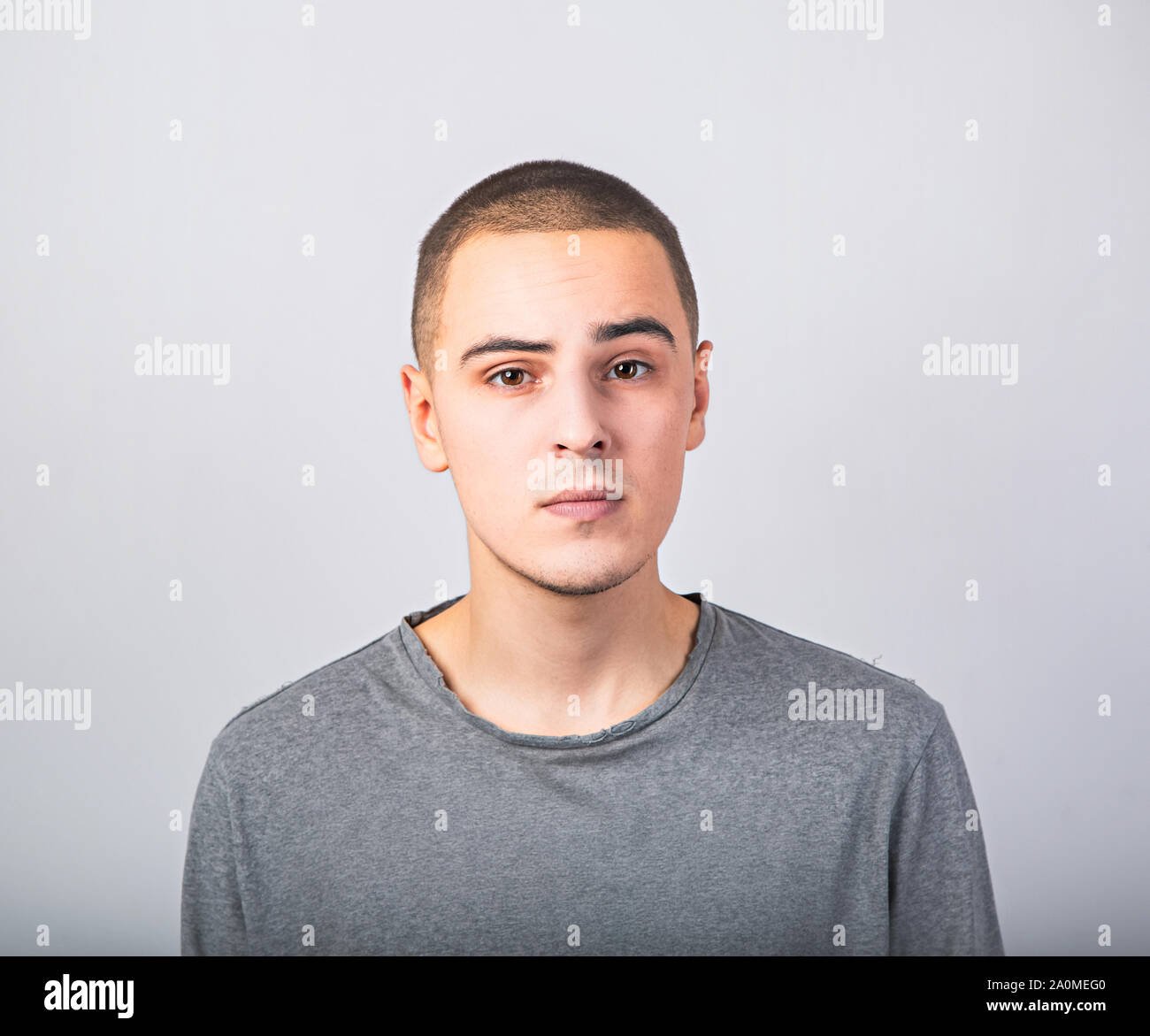 Skeptical serious man with grimacing face. Closeup studio portrait on ...