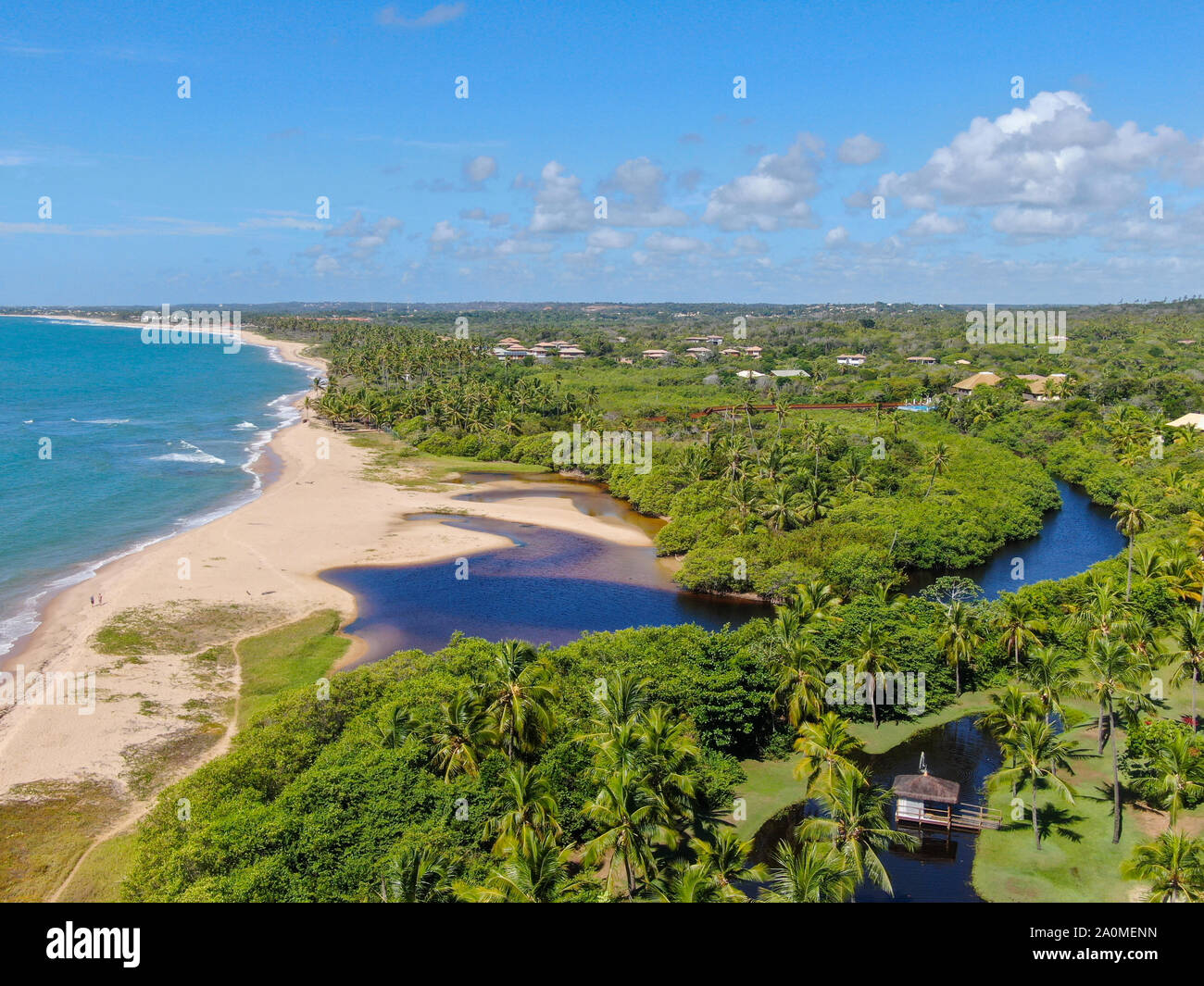 Aerial view of river merging to tropical white sand beach and turquoise ...