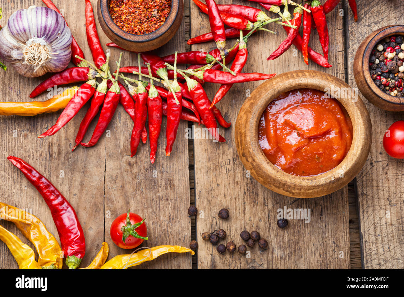 Chili sauce on wood background.Spicy sauce for meat food Stock Photo ...