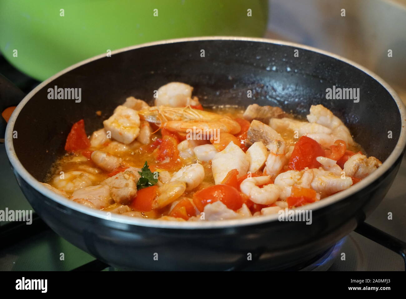 cooking fish ragout sauce for italian pasta Stock Photo - Alamy