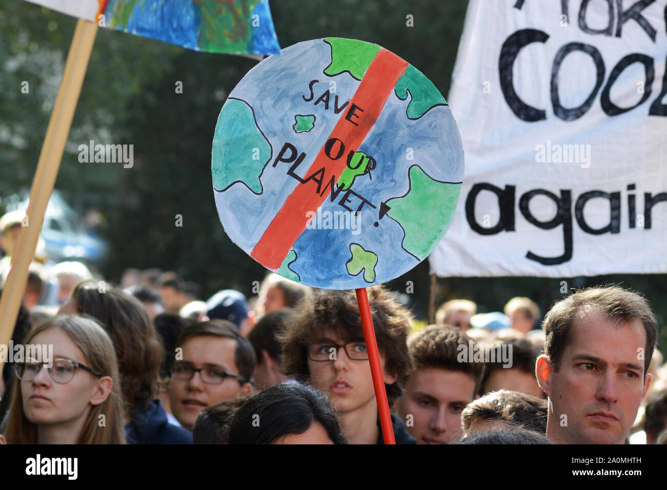 Germany: Round protest sign in the shape of planet earth saying 'Save ...