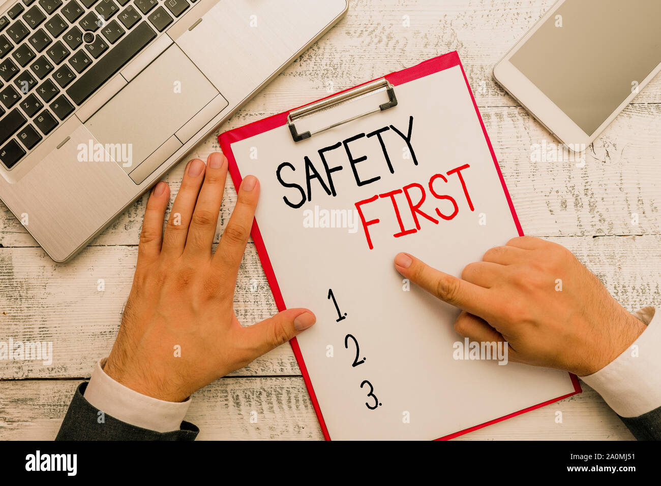 Writing note showing Safety First. Business concept for Avoid any ...