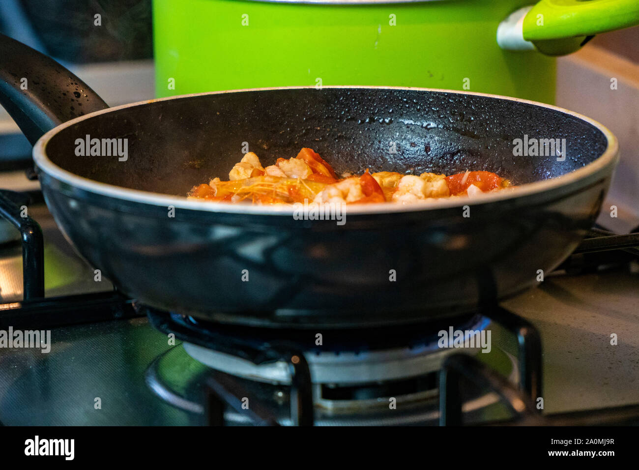 cooking fish ragout sauce for pasta Stock Photo - Alamy